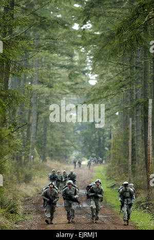 Soldiers complete a 12-mile ruck march and other timed events during ...