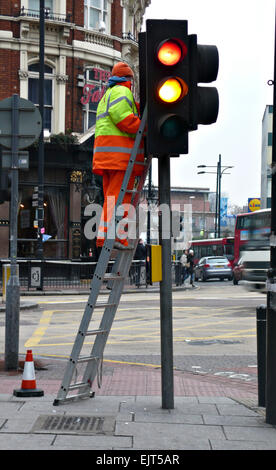 Man Fixing Traffic Lights Stock Photo - Alamy