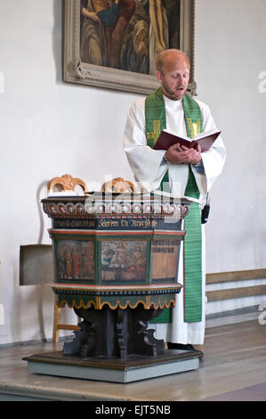A Norwegian priest in a rural church in Norway Stock Photo - Alamy