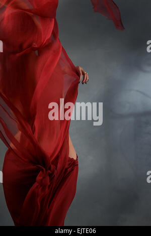 beautiful girl in red silk Stock Photo - Alamy