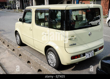 An interesting cuboid car, the Nissan Cube; small Japanese car parked ...