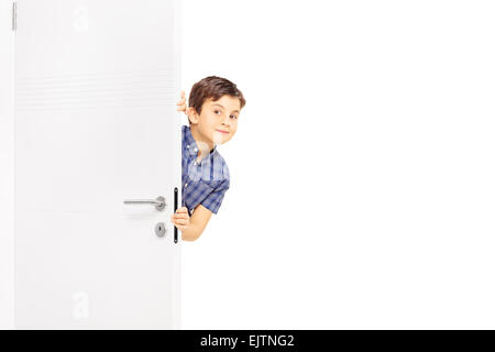 Curious little boy smiling into camera after working on robot Stock ...
