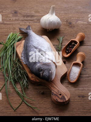 Closeup shot of fresh sea bream and mackerel displayed in a wet market ...