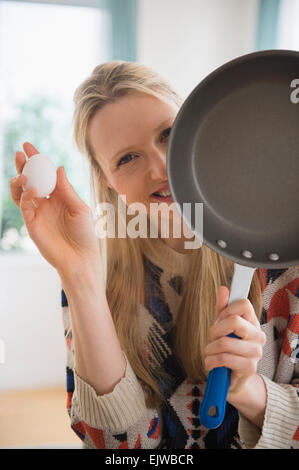 Woman with a pan Stock Photo - Alamy