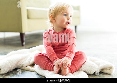 Baby boy sitting in the room Stock Photo - Alamy