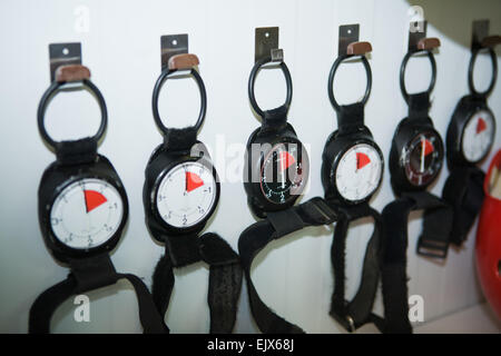 Several altimeters used for skydiving ready to use, amd helmets Stock ...