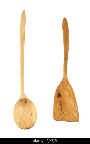 Kitchen wooden utensil of scapula, spoon and fork on wooden table Stock ...