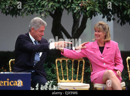 US President Bill Clinton jokes with first lady Hillary Clinton and ...