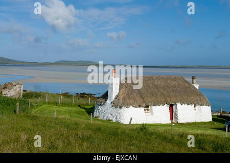 Traditional croft house thatched cottage at Malacleit on Outer Hebrides ...