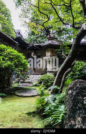 View of a traditional Japanese courtyard 'tsubo-niwa' garden with old ...
