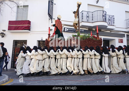 Hooded men carrying float during Procession, Holy week, semana santa ...