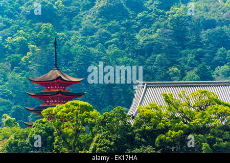 The five-storied pagoda in a forest of cedar trees with deep snow at ...