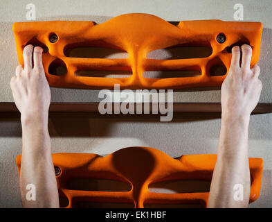 Cropped view of rock climber performing three-finger pull-ups Stock ...