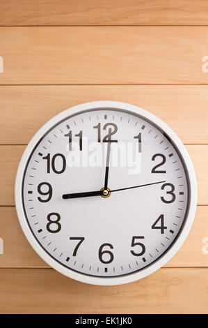 wall clock on wooden background Stock Photo - Alamy