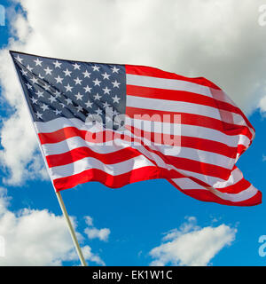 US flag and cumulus clouds behind it Stock Photo - Alamy