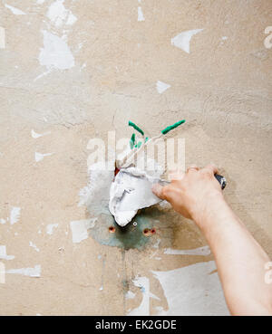 man plastering the wall. Construction, repairs in the house. Selective ...
