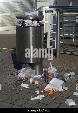Overflowing litter bin on the pavement outside a Starbucks Coffee Shop ...