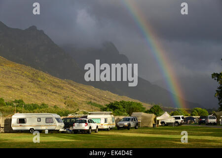 A rainbow over the campsite of Goudini in the Western Cape Stock Photo ...