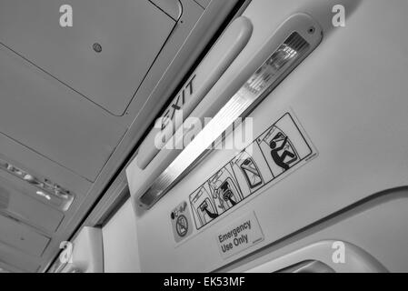Italy, airplane cabine, emergency exit light Stock Photo - Alamy