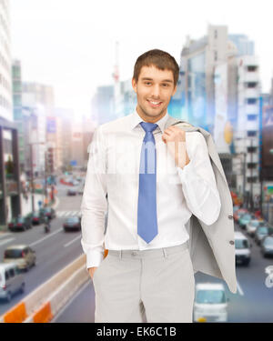Young man architect standing with relaxed expression looking blueprint ...