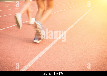 Close up Running track with blur of runner feet in stadium Stock Photo ...