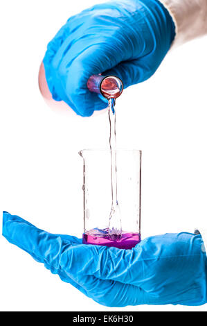 laboratorian reagent pouring on white isolated background Stock Photo ...