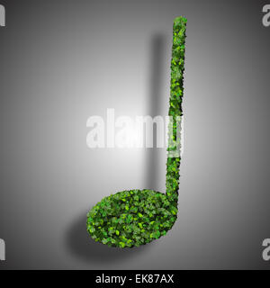 Musical note crotchet symbol made from green leaves isolated on white ...