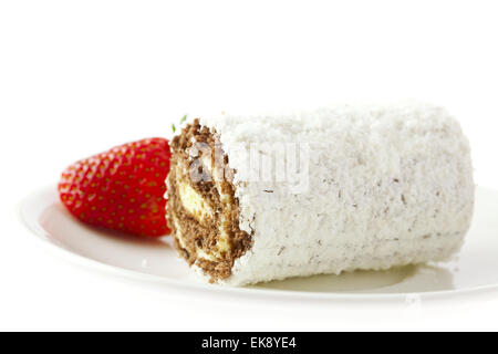 Roll cake and strawberries in the plate on a wooden table Stock Photo ...