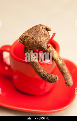 Teddy bear handmade in a cup and nuts Stock Photo - Alamy