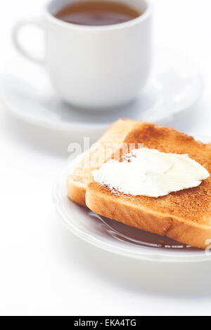 tea and toast with butter isolated on white Stock Photo - Alamy