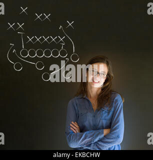 Woman businesswoman with american football Stock Photo - Alamy