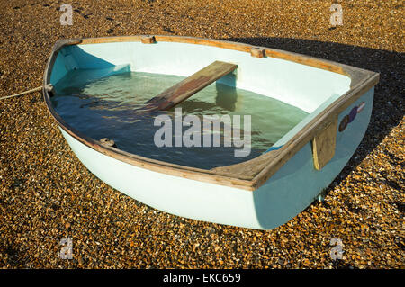 Dingy full of rainwater Stock Photo - Alamy