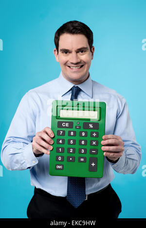 Male executive displaying green calculator isolated over white Stock ...