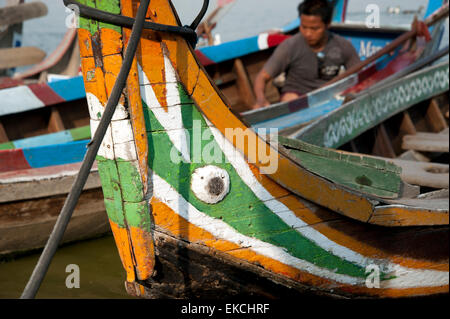 Evil eye on the bow of a traditional wooden Luzzu fishing boat on the ...