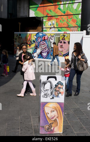 Street portrait caricatures and construction artwork faces in Leicester ...