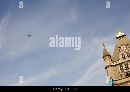 An airplane flying over the Tower Bridge of London,UK. Airplane low ...