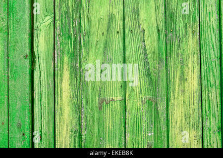 Strongly weathered wooden planks with peeling paint, showcasing rough ...