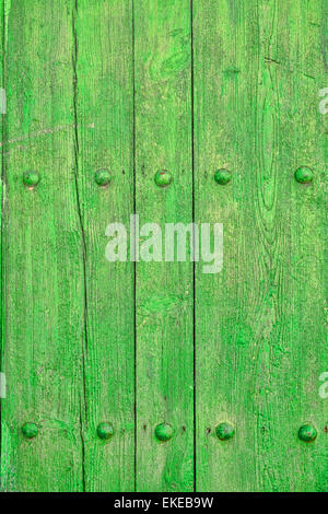 Strongly weathered wooden planks with peeling paint, showcasing rough ...