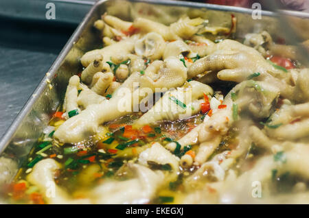 Cold dish spicy chicken feet skin Stock Photo - Alamy