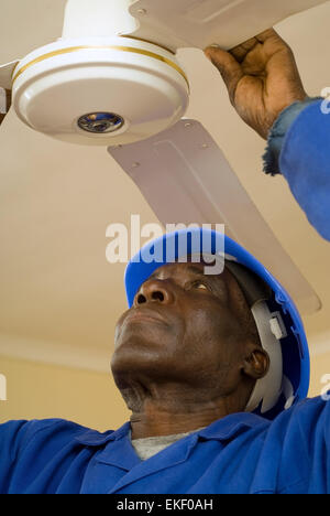 Construction Worker Fixing Ceiling Fan Stock Photo - Alamy