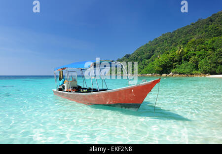 Beautiful beach with motor boat Stock Photo - Alamy