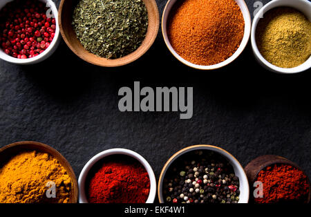 Assorted spices on stone background Stock Photo - Alamy