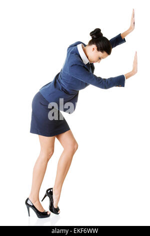 Woman pushing something imaginary Stock Photo - Alamy