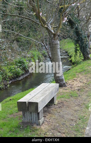 Bench seat beside the creek Stock Photo - Alamy