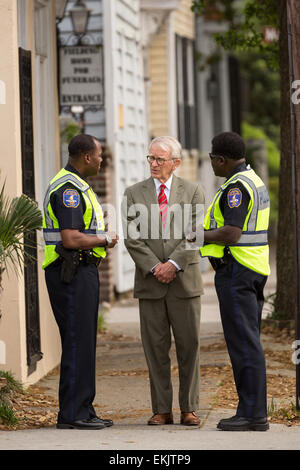 Charleston Mayor Joe Riley greets police officers standing outside ...