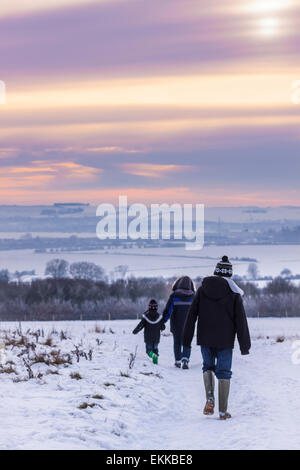 As sunset approaches the mist hangs in valleys over snowy, Oxfordshire ...