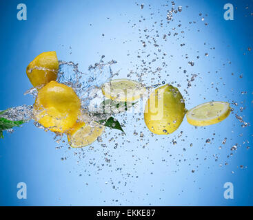 Fresh limes, on blue background Stock Photo - Alamy