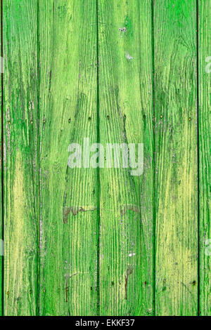 Strongly weathered wooden planks with peeling paint, showcasing rough ...