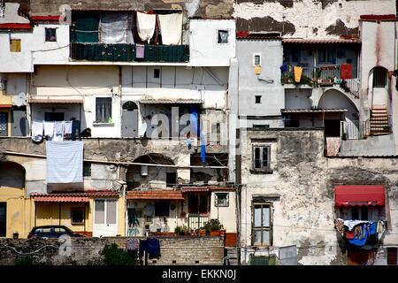 Homes in Ercolano, a poor suburb of Naples, Italy showing living ...