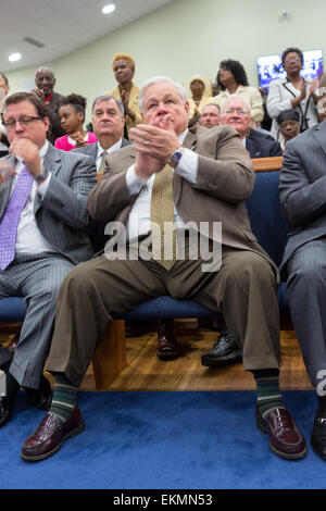 Rev. Al Sharpton, center right, hugs Stevante Clark during the funeral ...